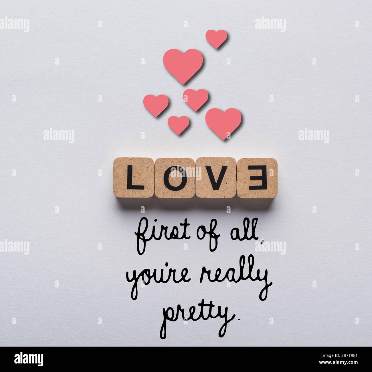 top view of cubes with love lettering on white background with first of ...