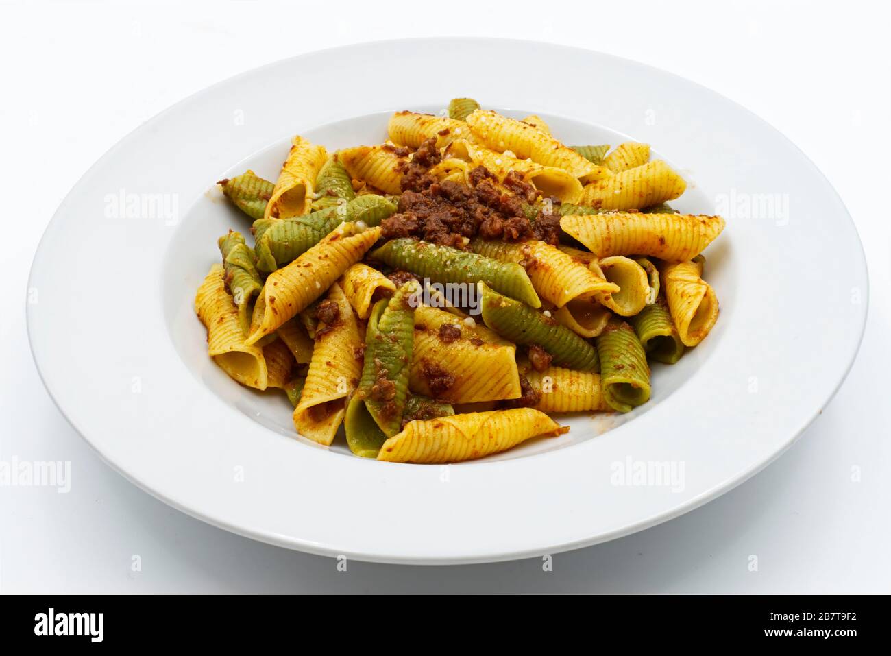 Traditional italian colorful pasta. Maccheroni al pettine, isolated on ...