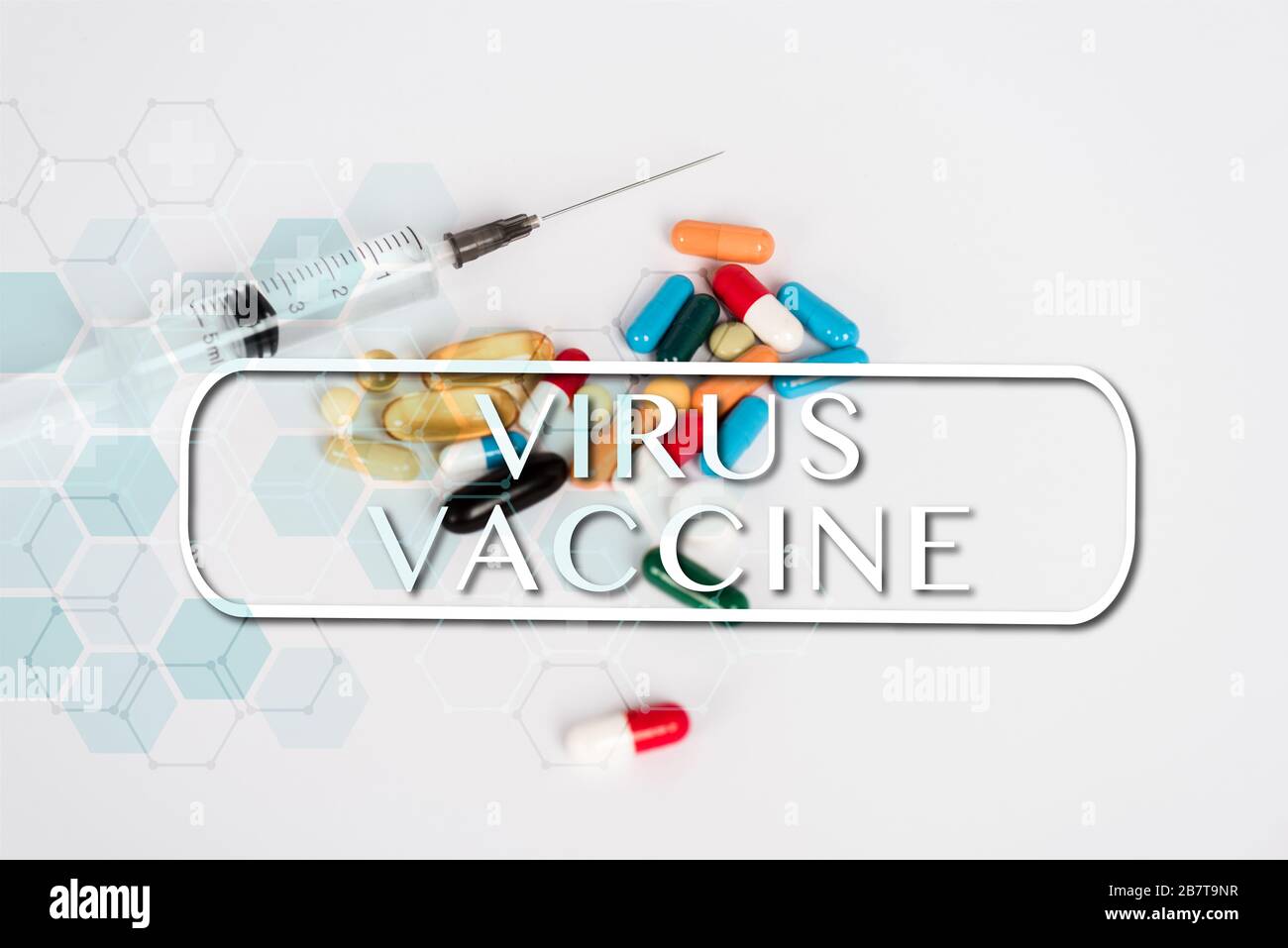 colorful pills near syringe and virus vaccine lettering on white Stock ...