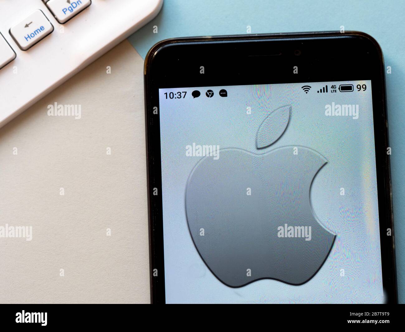 In this photo illustration Apple logo is seen displayed on a smartphone ...