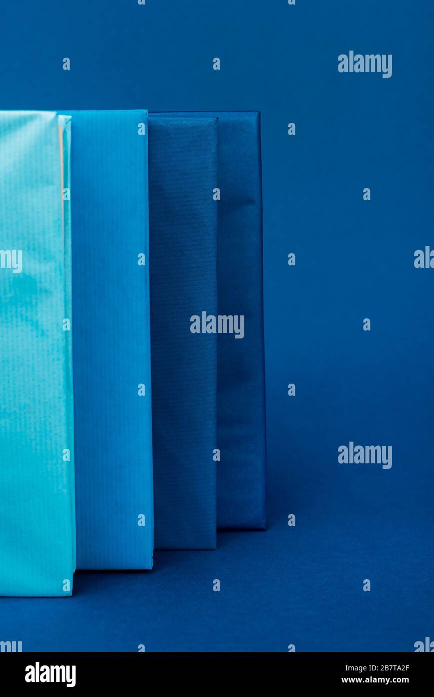bright books on blue background with copy space Stock Photo - Alamy