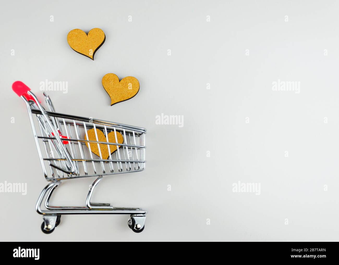 cart and heart on a white background Stock Photo - Alamy