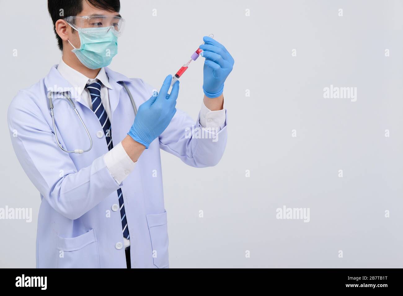 doctor physician practitioner with medicine syringe vial ampule ...