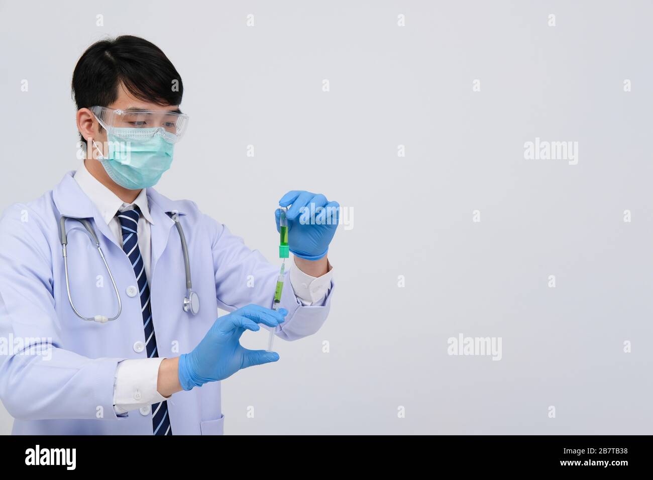 doctor physician practitioner with medicine syringe vial ampule ...