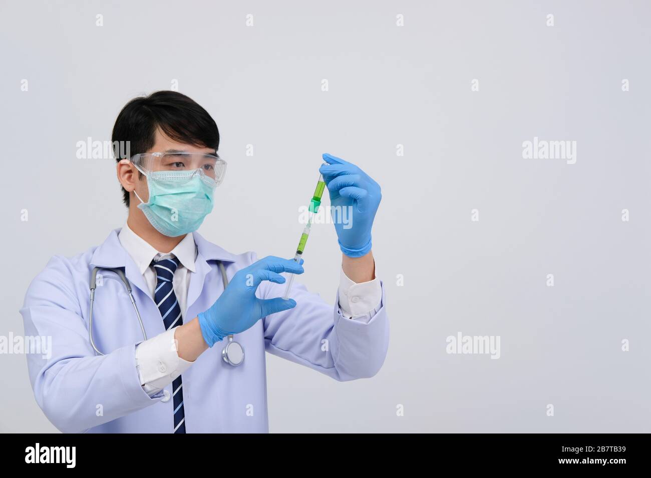 doctor physician practitioner with medicine syringe vial ampule ...