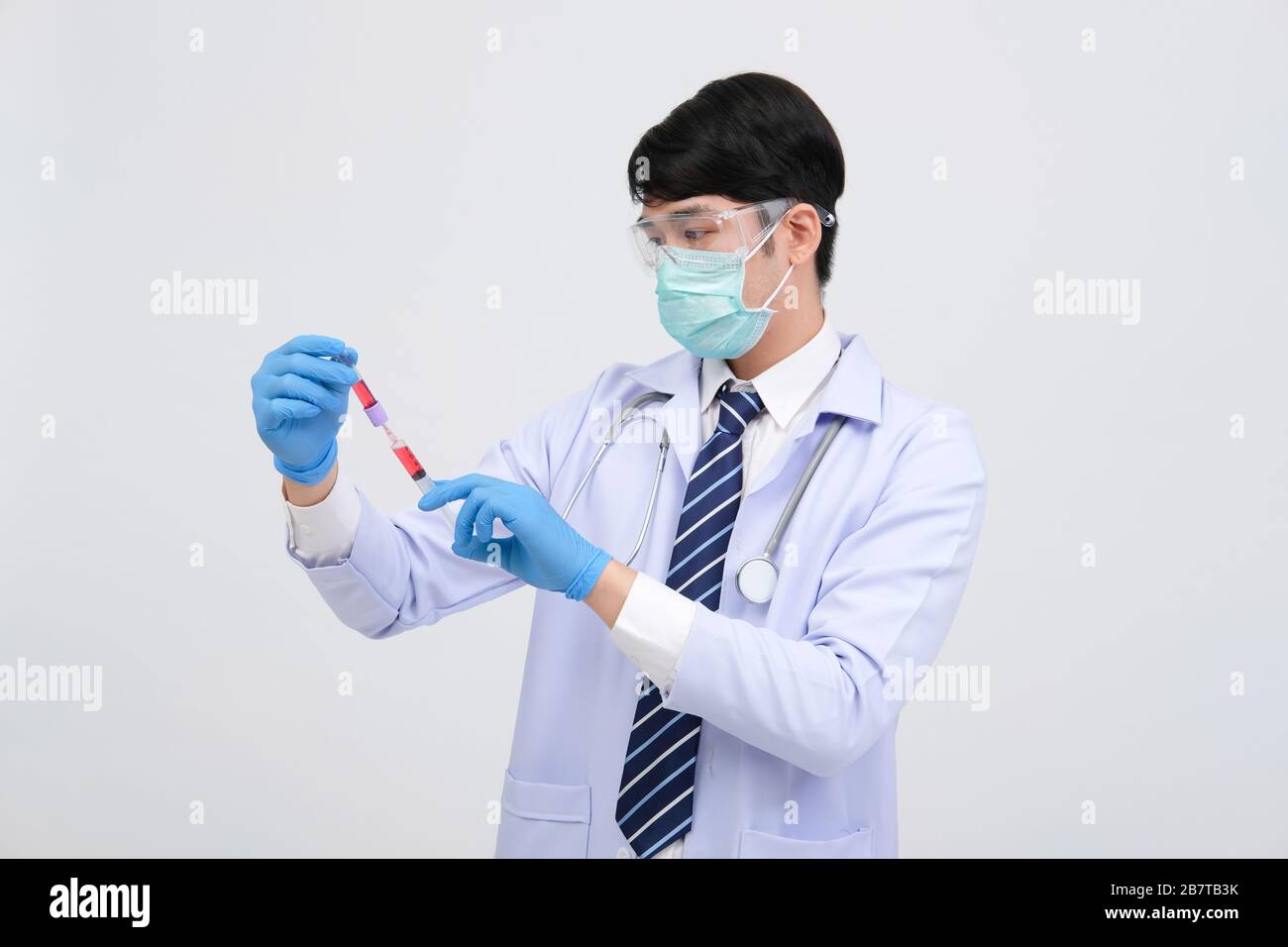 doctor physician practitioner with medicine syringe vial ampule ...