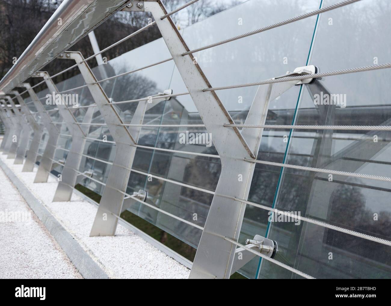 methods of fastening the bridge wire ropes glass metal Stock Photo - Alamy