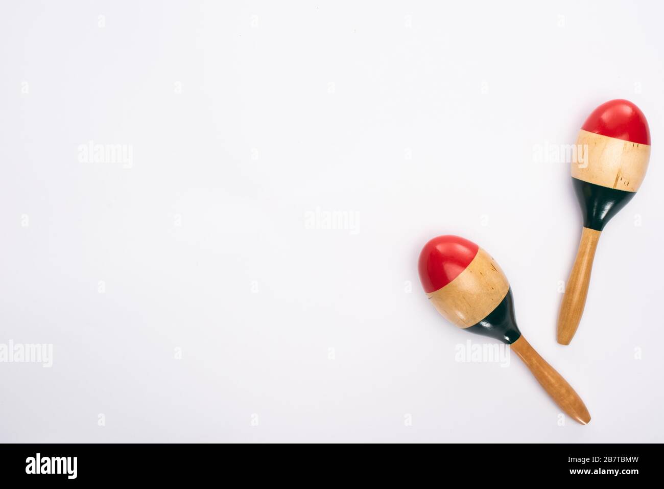 Top view of wooden colorful maracas on white background Stock Photo - Alamy