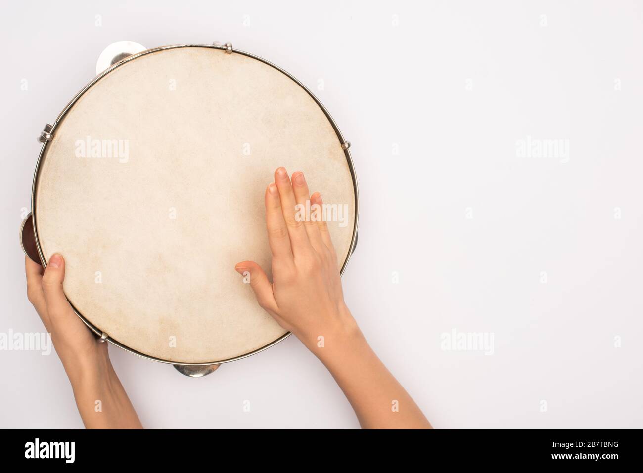 Woman playing tambourine hi-res stock photography and images - Alamy