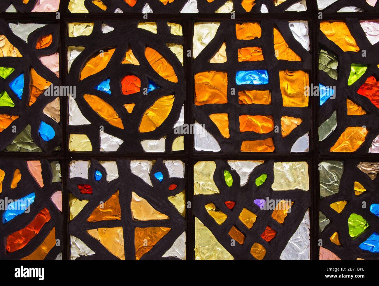 Window stained glass with multi colored glass Stock Photo - Alamy