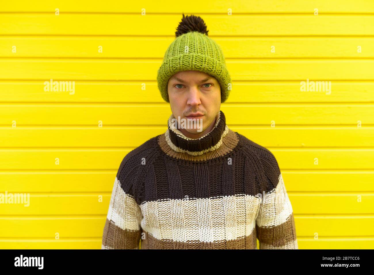 Young man against yellow hi-res stock photography and images - Alamy