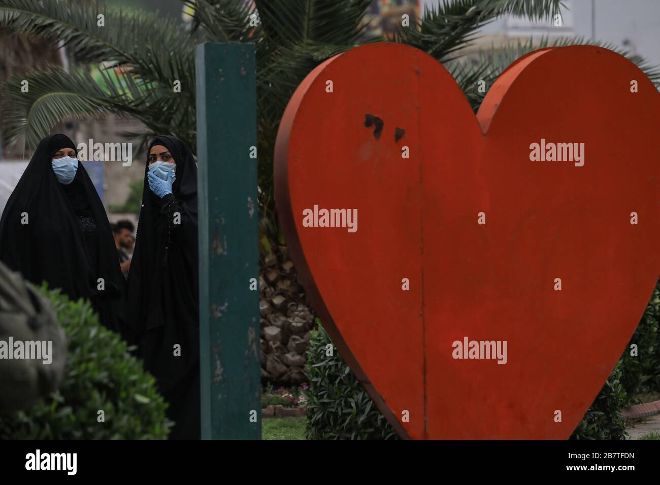 Baghdad, Iraq. 17th Mar, 2020. Iraqi women are seen wearing face masks ...