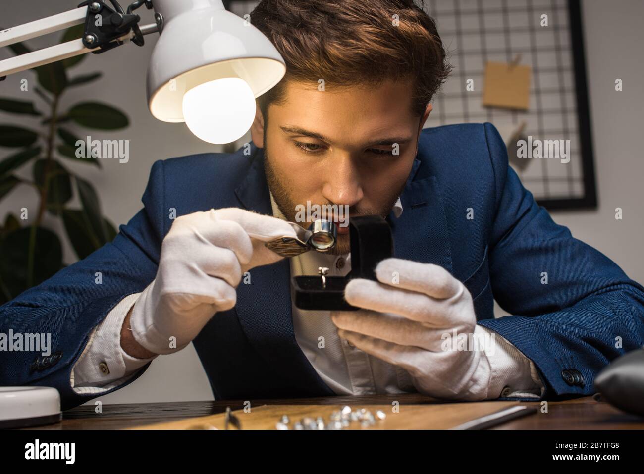 Examining diamonds hi-res stock photography and images - Alamy