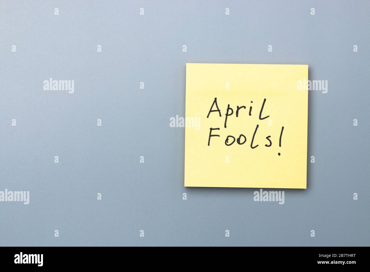 april fools day reminder on yellow sticky note. be aware and do not let ...