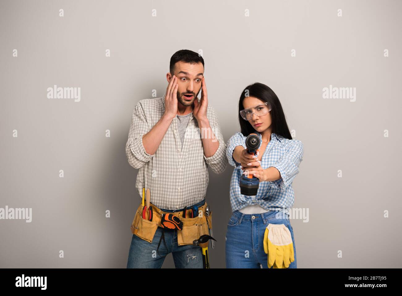 Woman man tools drill hi-res stock photography and images - Alamy