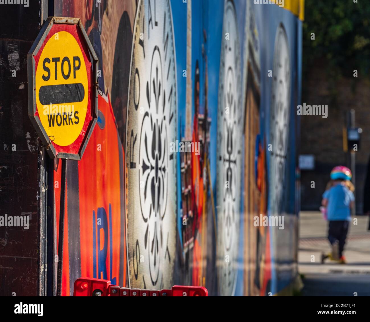 Building Site Safety, a child scoots safely past a building site ...