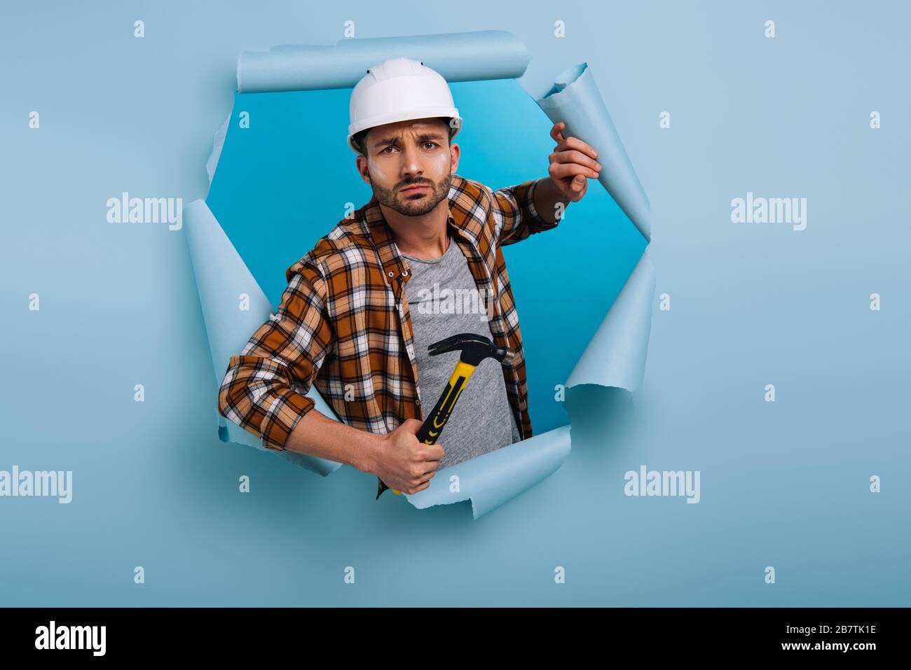 Angry repairman hammer in hi-res stock photography and images - Alamy