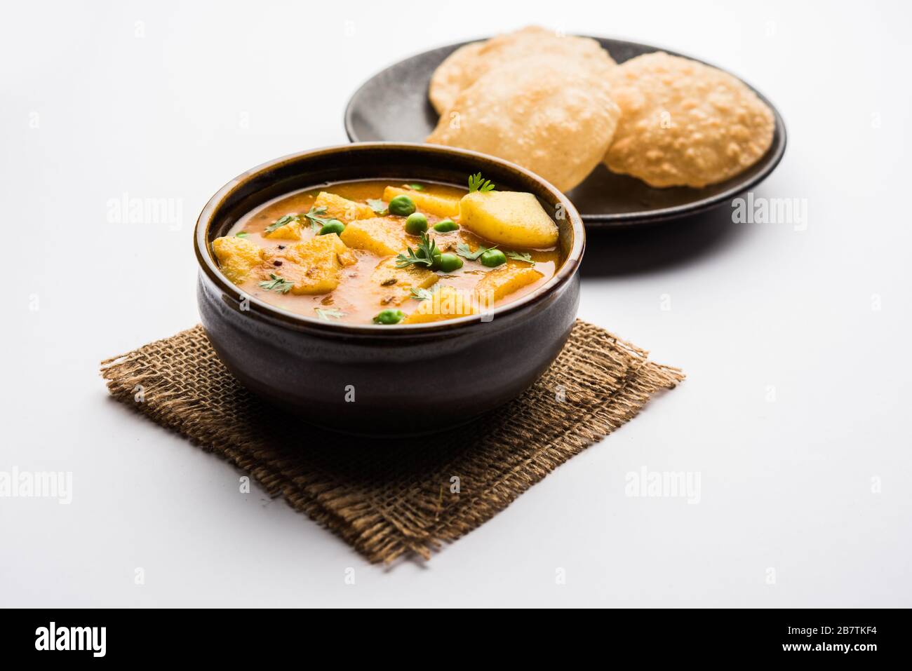Aloo Puri or Potato curry with fried Poori, popular Indian breakfast ...