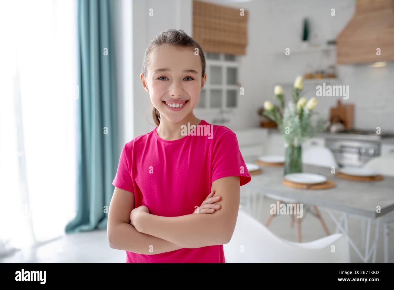 Pretty girl in a bright tshirt smiling nicely Stock Photo - Alamy