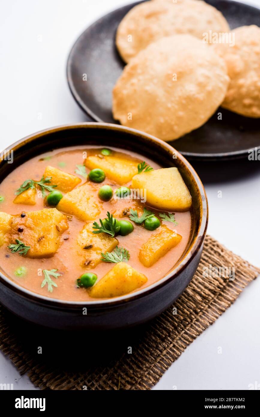 Aloo Puri or Potato curry with fried Poori, popular Indian breakfast ...