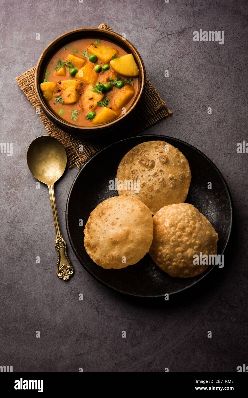 Aloo Puri or Potato curry with fried Poori, popular Indian breakfast ...
