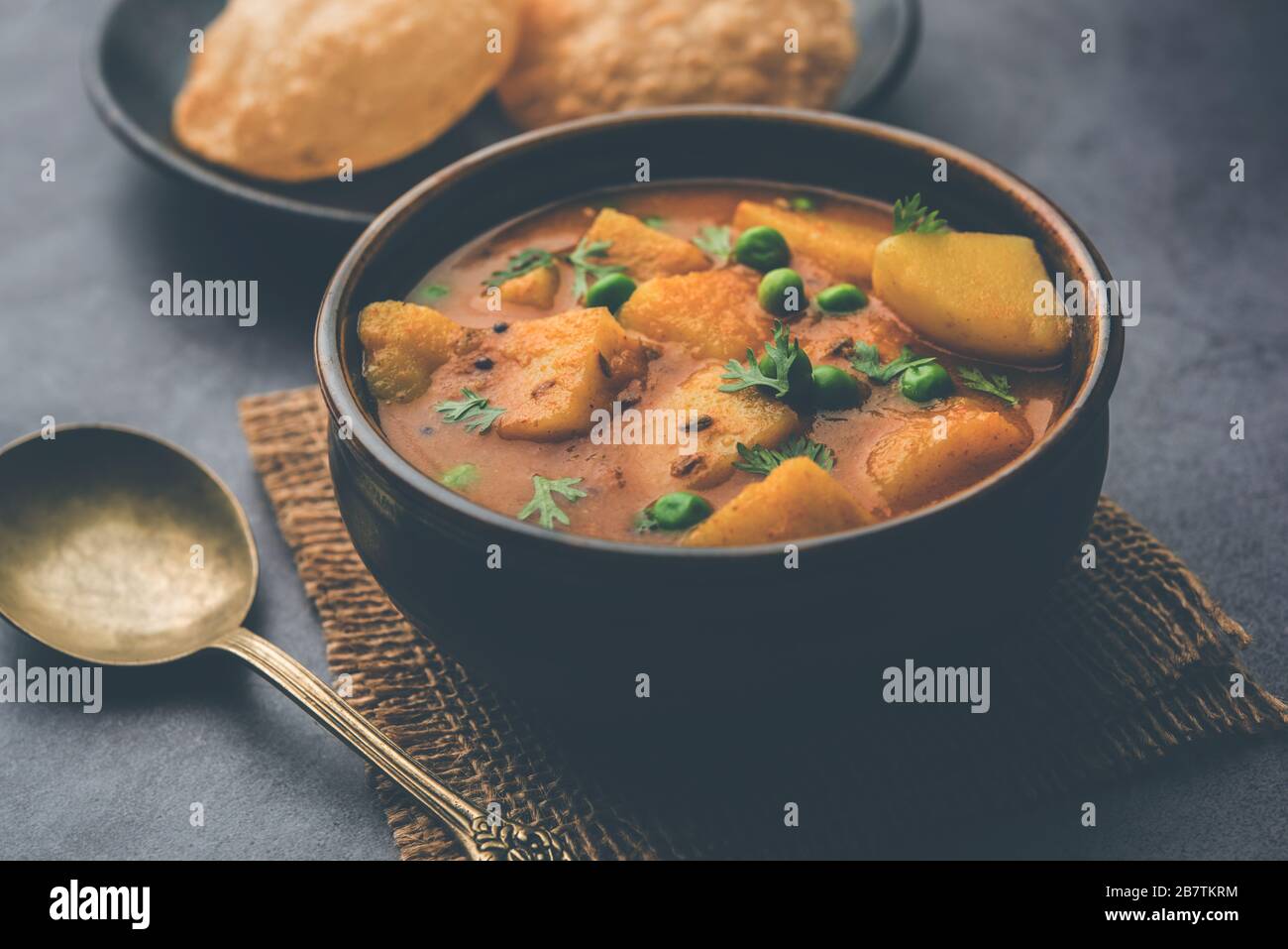 Aloo Puri or Potato curry with fried Poori, popular Indian breakfast ...