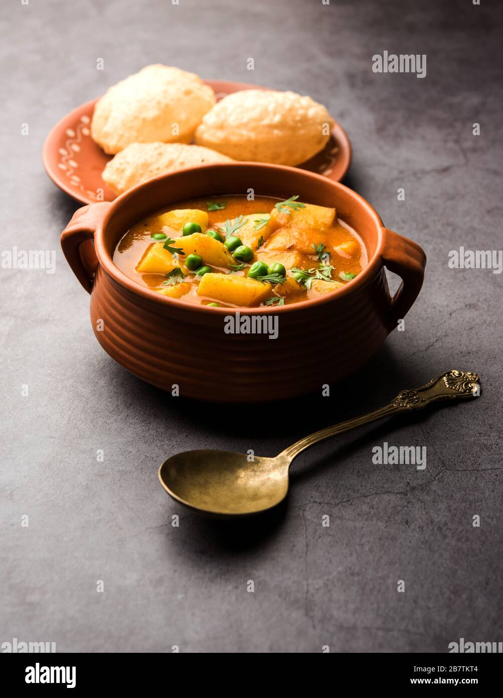 Aloo Puri or Potato curry with fried Poori, popular Indian breakfast ...