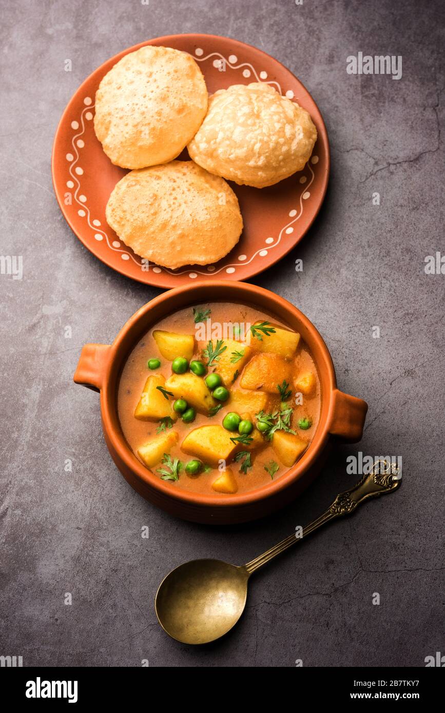 Aloo Puri or Potato curry with fried Poori, popular Indian breakfast ...