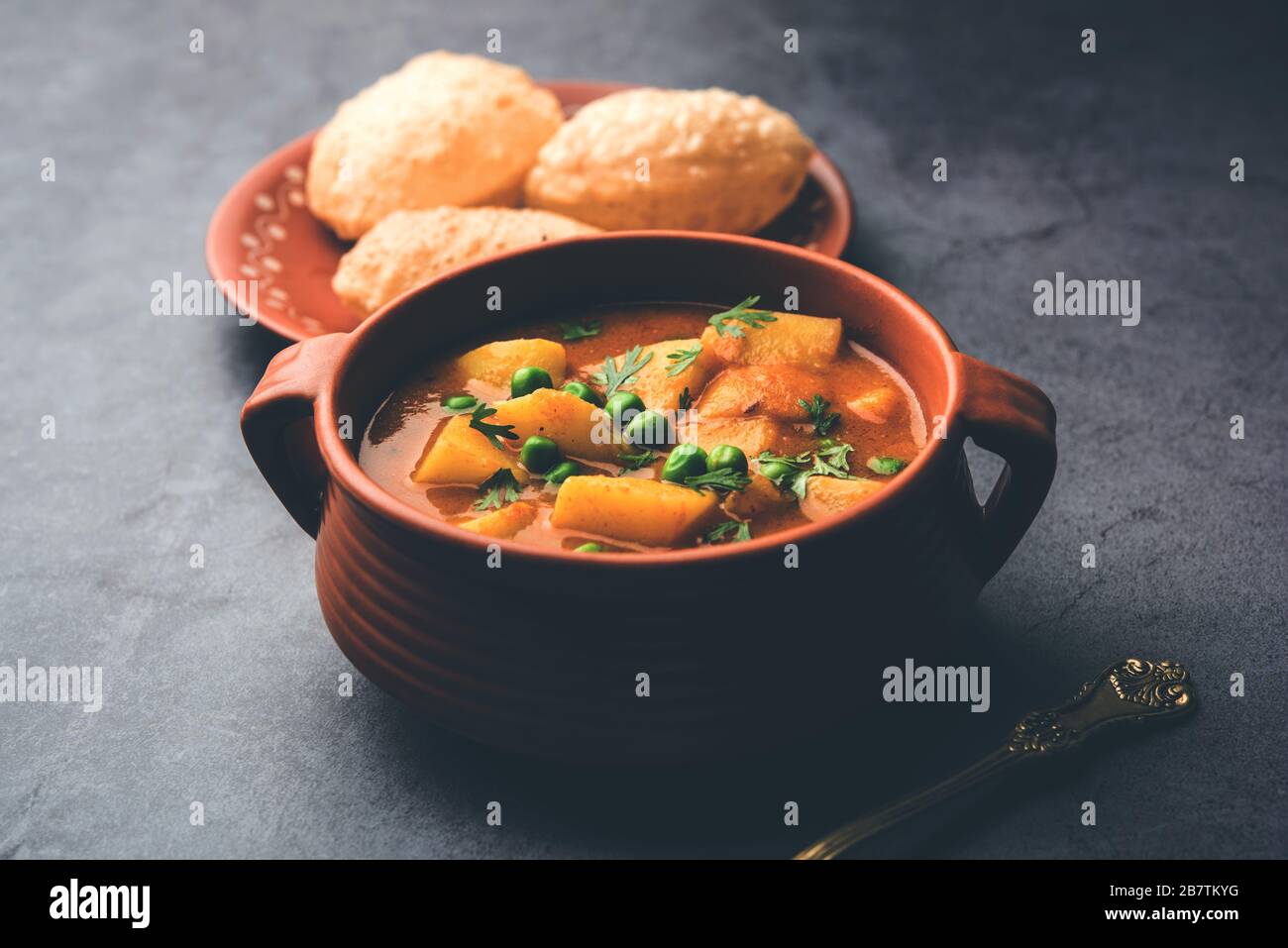 Aloo Puri or Potato curry with fried Poori, popular Indian breakfast ...