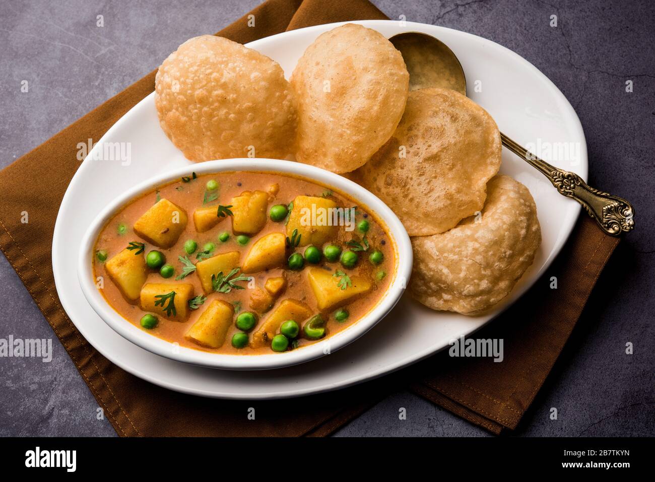 Aloo Puri or Potato curry with fried Poori, popular Indian breakfast ...