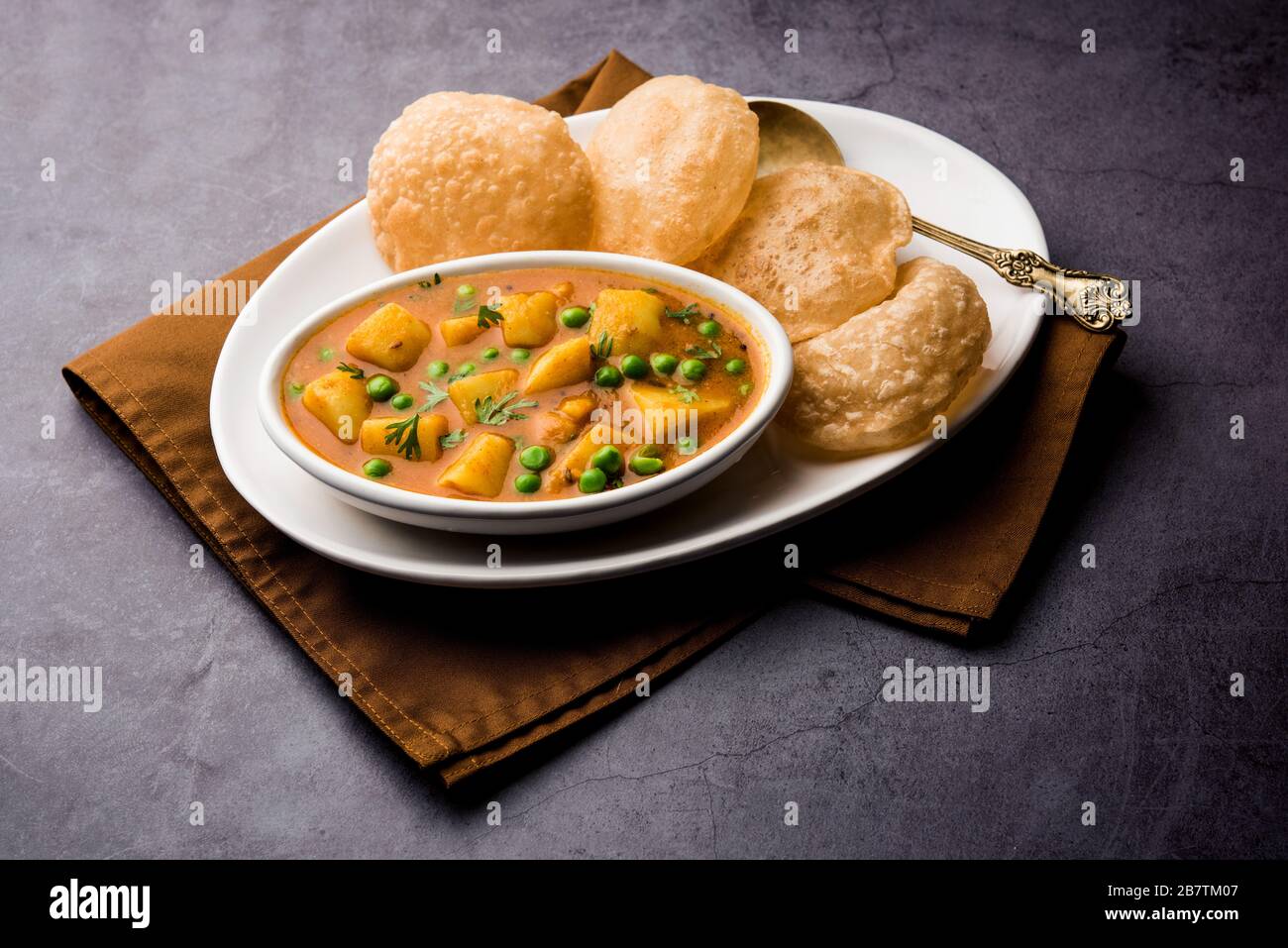 Aloo Puri or Potato curry with fried Poori, popular Indian breakfast ...