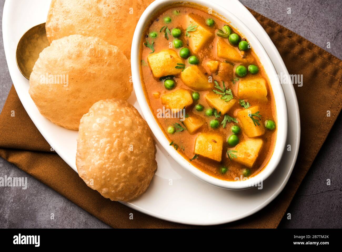 Aloo Puri or Potato curry with fried Poori, popular Indian breakfast ...