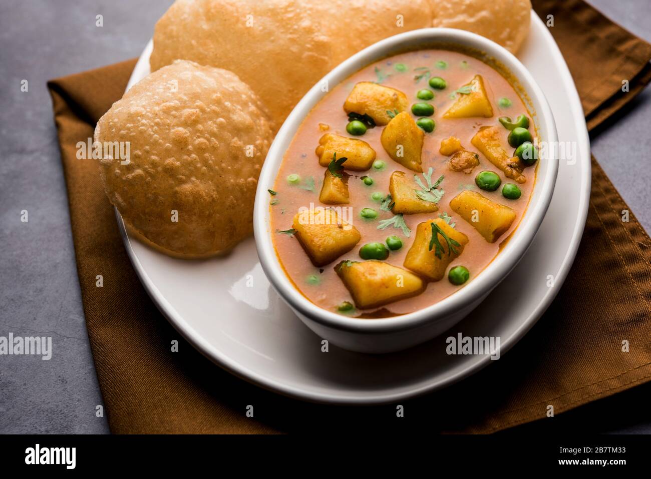 Aloo Puri or Potato curry with fried Poori, popular Indian breakfast ...