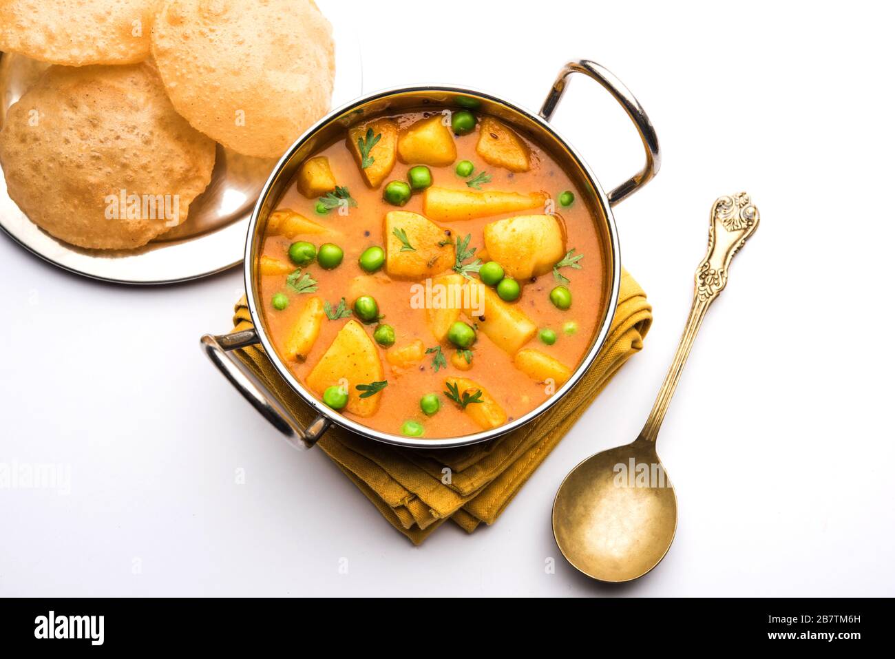 Aloo Puri or Potato curry with fried Poori, popular Indian breakfast ...