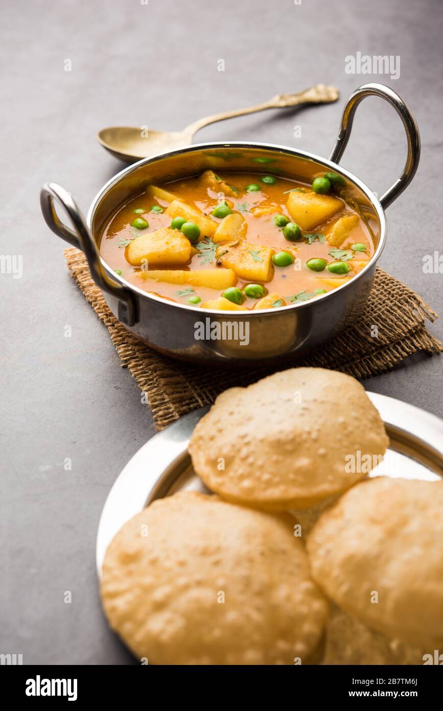 Aloo Puri or Potato curry with fried Poori, popular Indian breakfast ...