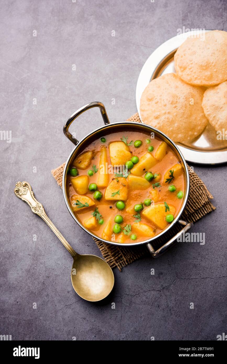 Aloo Puri or Potato curry with fried Poori, popular Indian breakfast ...