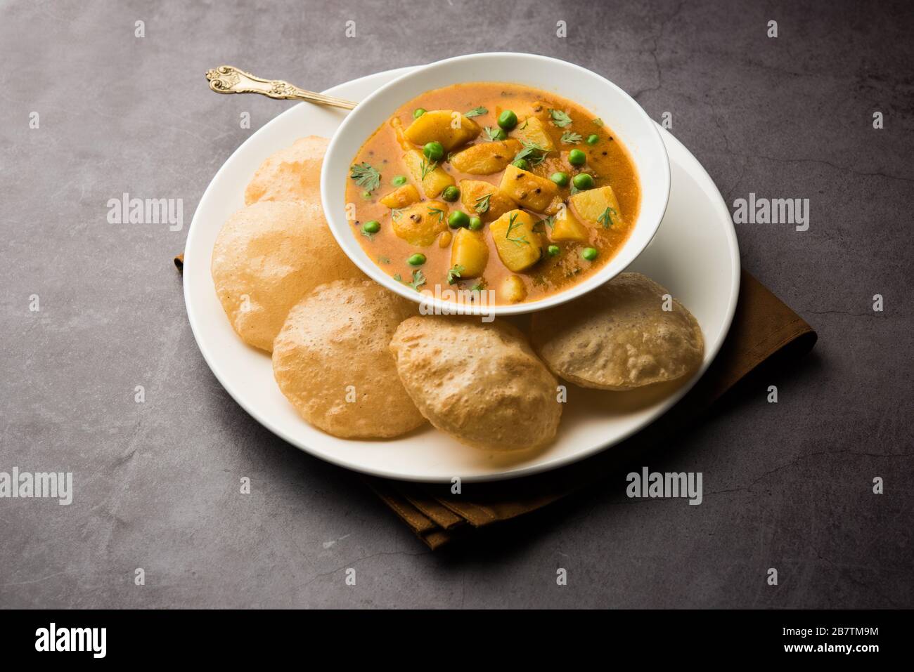 Aloo Puri or Potato curry with fried Poori, popular Indian breakfast ...
