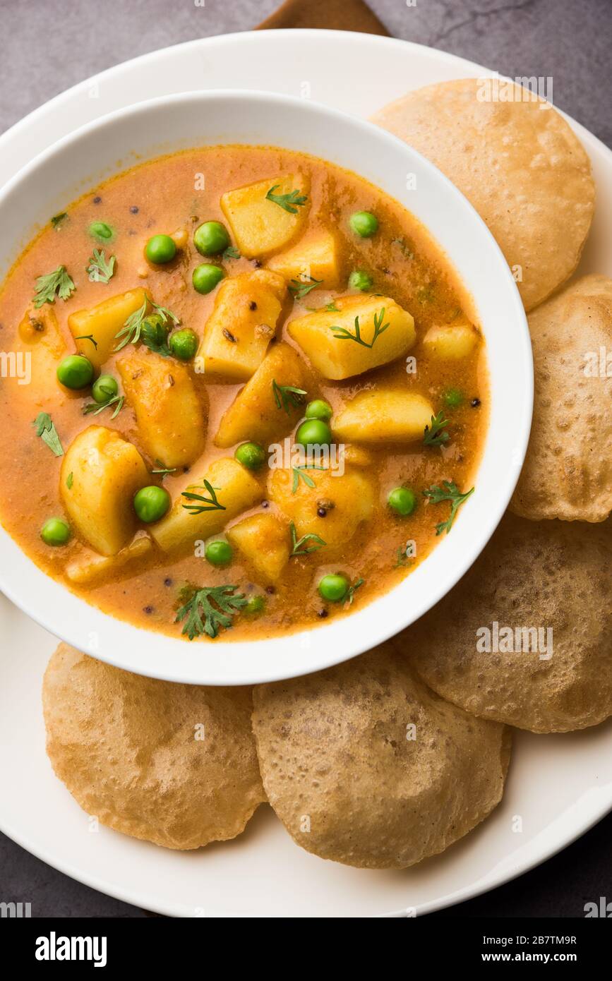 Aloo Puri or Potato curry with fried Poori, popular Indian breakfast ...
