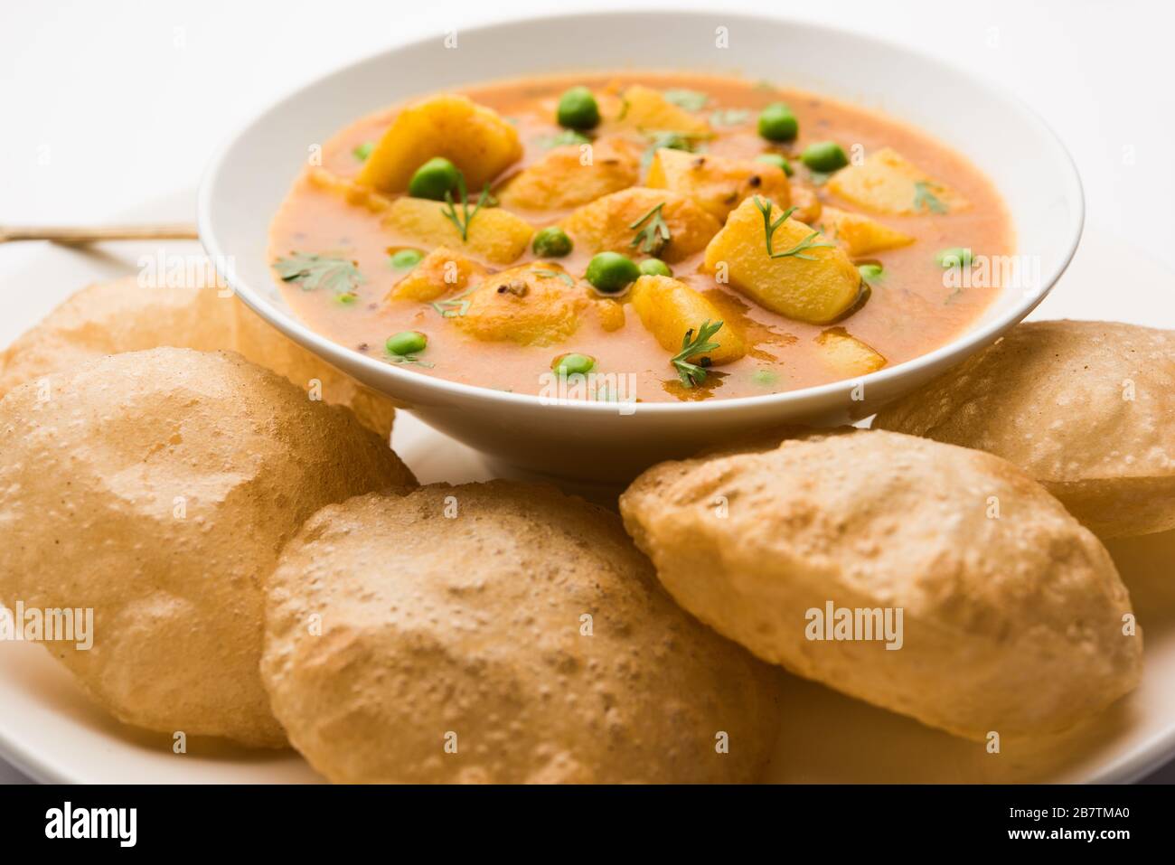Aloo Puri or Potato curry with fried Poori, popular Indian breakfast ...