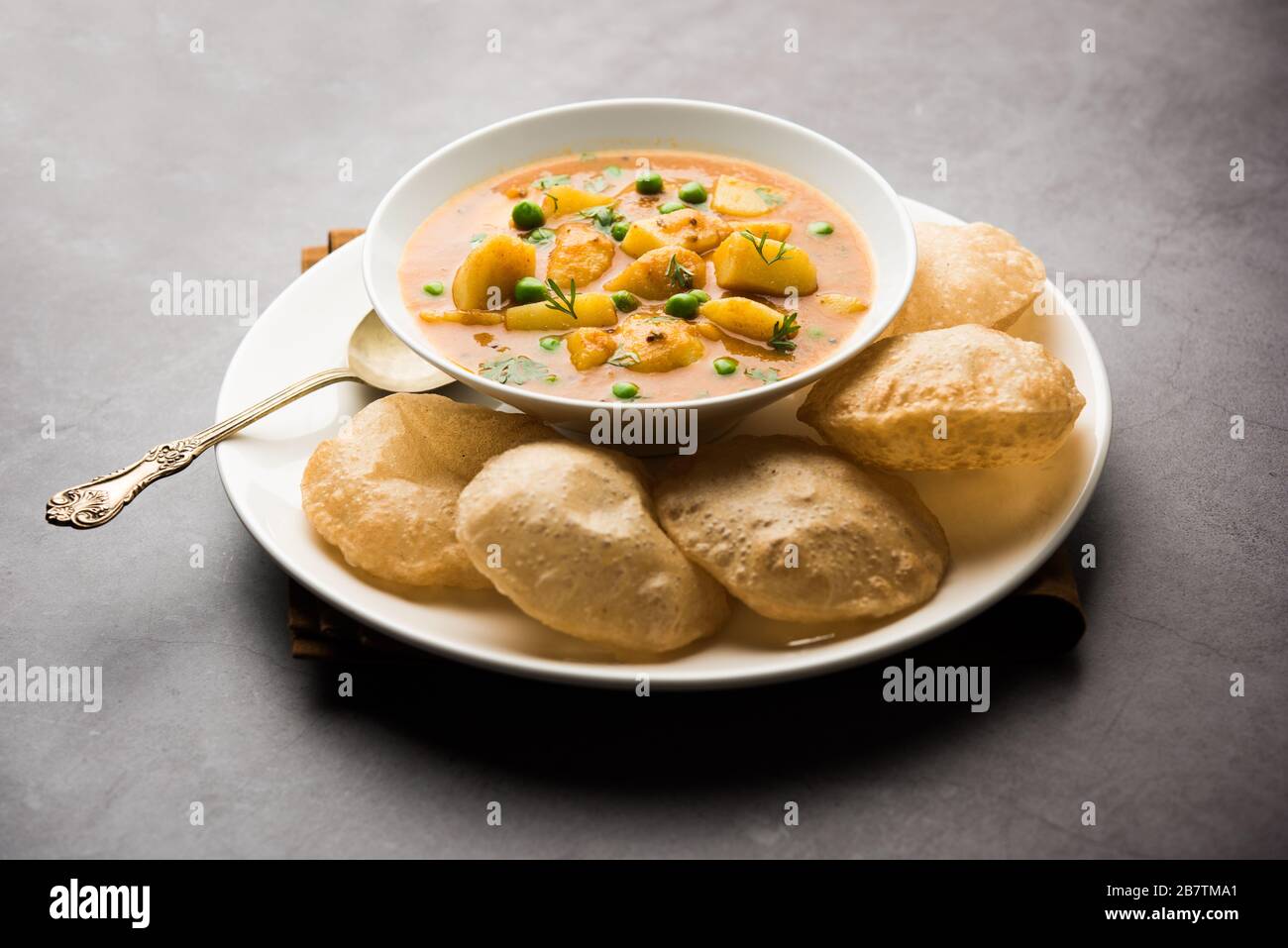 Aloo Puri or Potato curry with fried Poori, popular Indian breakfast ...
