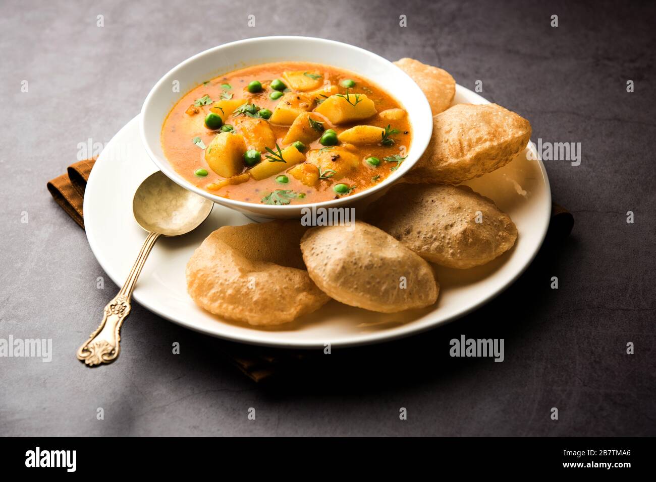 Aloo Puri or Potato curry with fried Poori, popular Indian breakfast ...