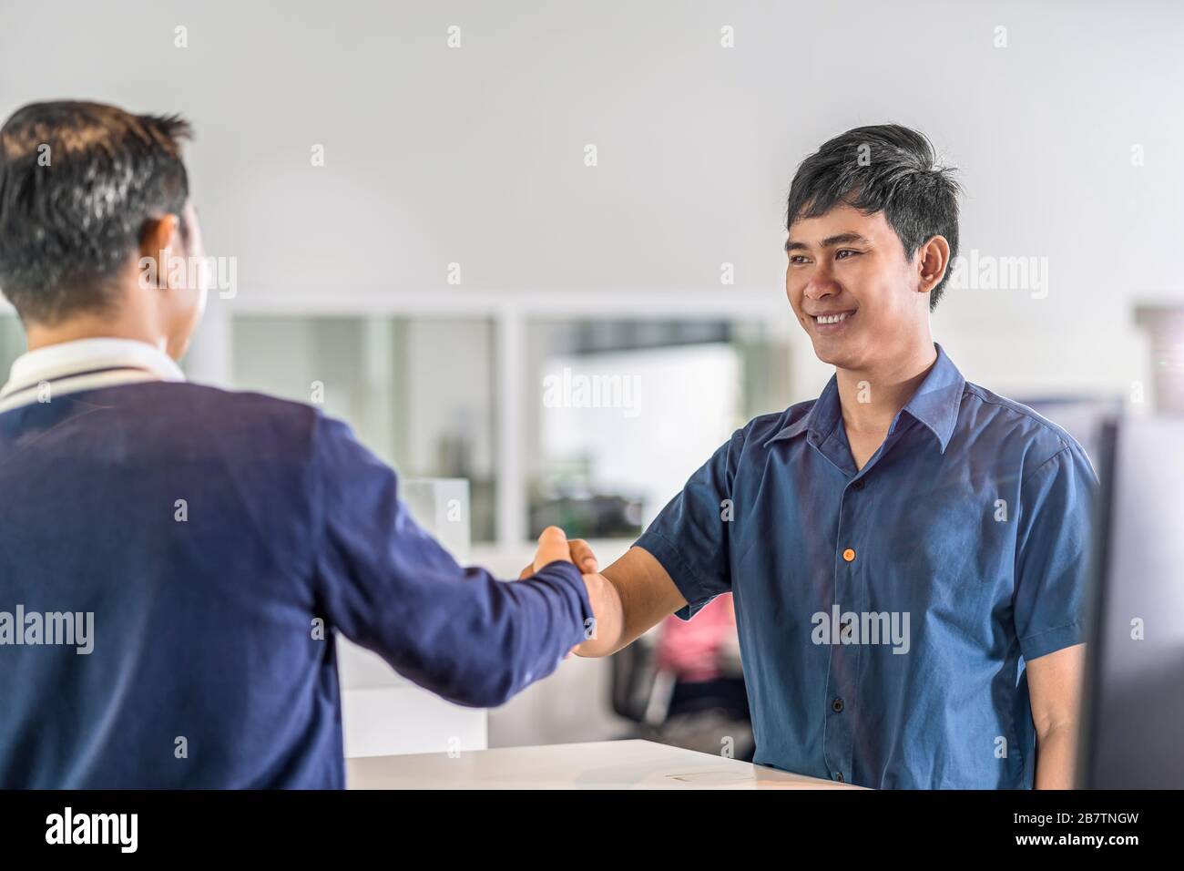 Asian Mechanic handshake with the customer and leader in maintenance ...