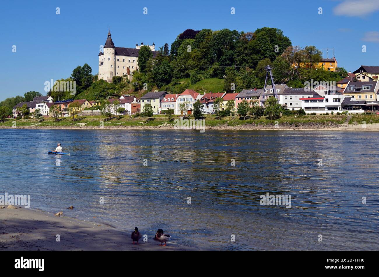 Austria, castle Ottensheim and man in canoe on Danube river Stock Photo ...