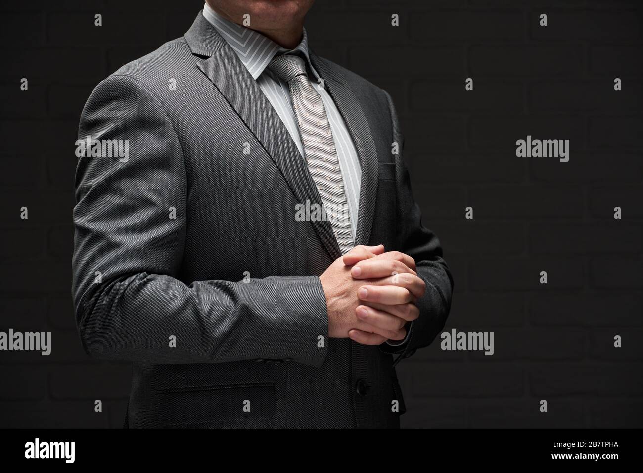 businessman portrait dressed in gray suit, dark wall background Stock ...