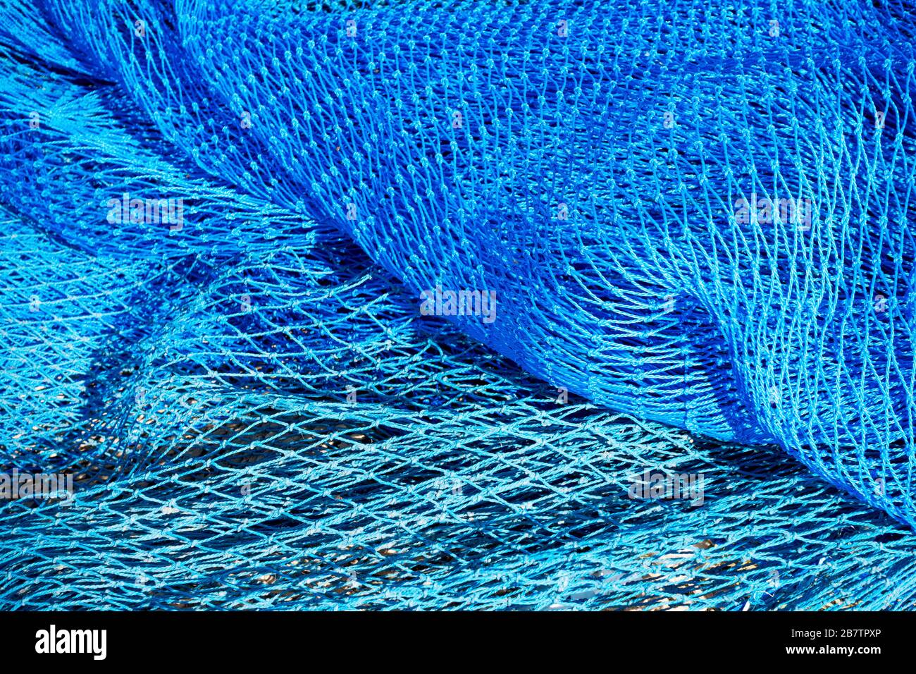 Commercial blue color fishing nets background. Top view Stock Photo - Alamy
