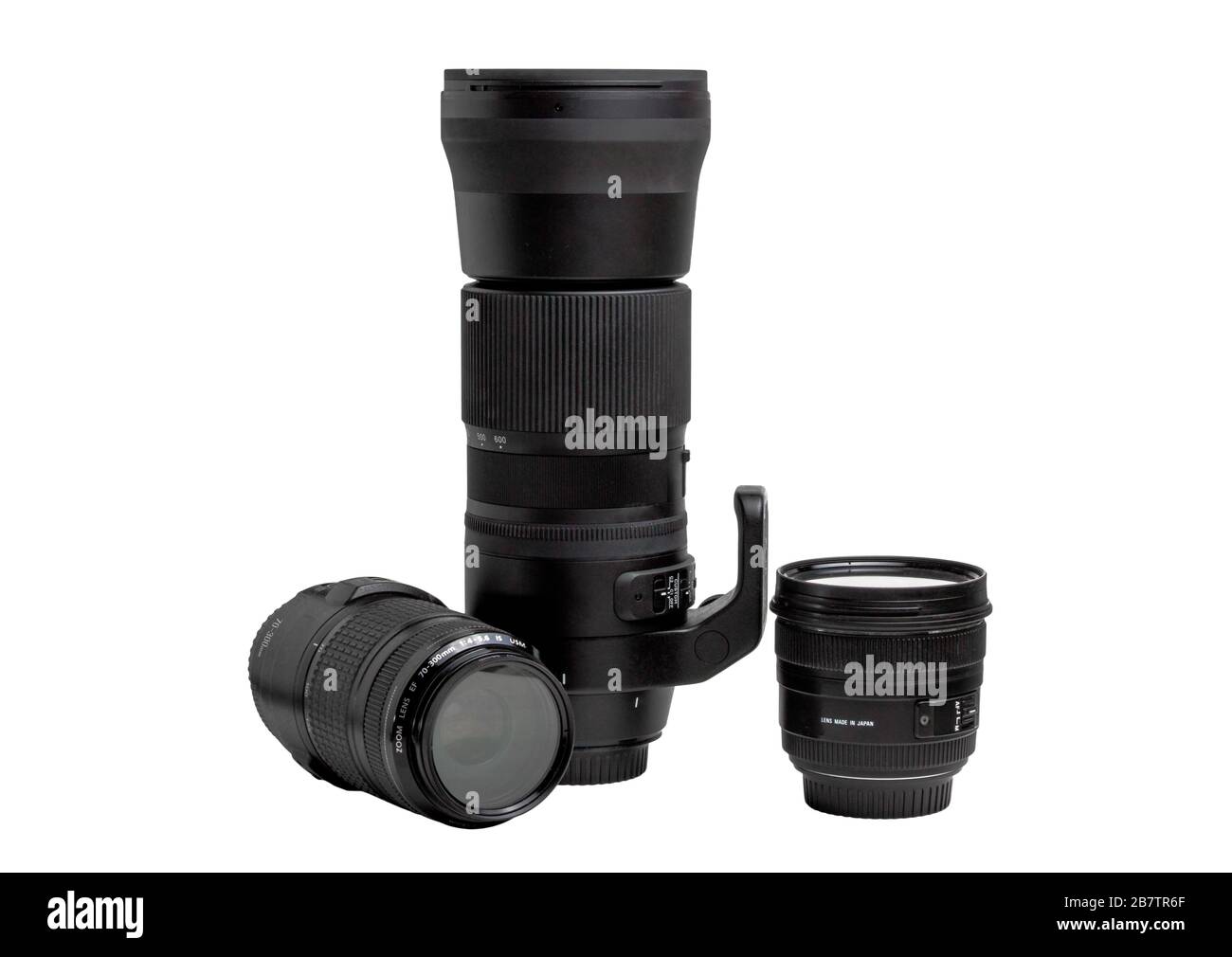 image of three auto focus lenses for the camera on a white background ...