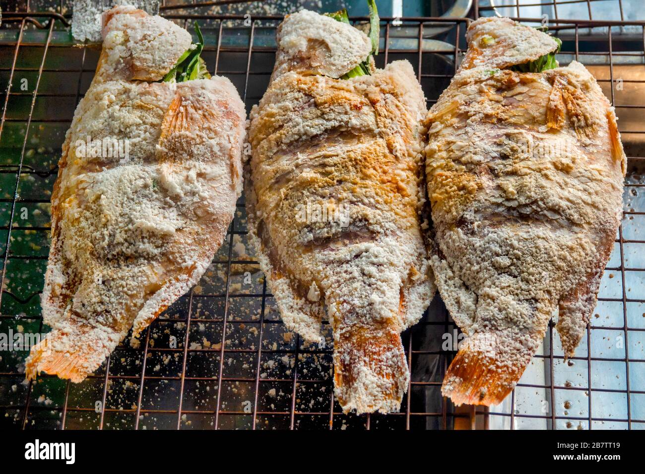 Pla Pao, Thai salt grilled fish Stock Photo - Alamy