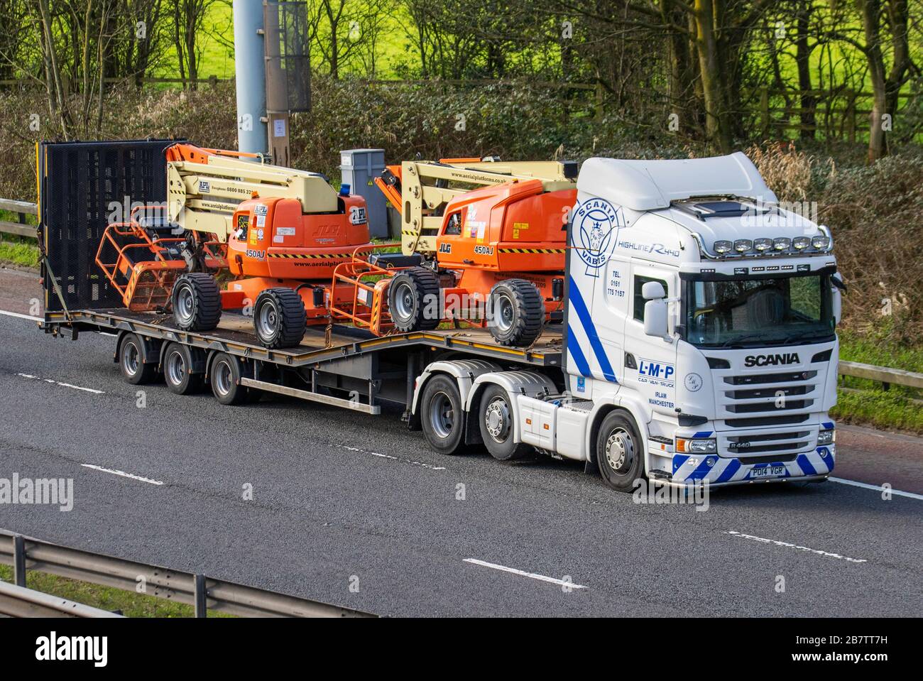 JLG engine powered boom lifts. Cherry pickers being carried by Haulage ...