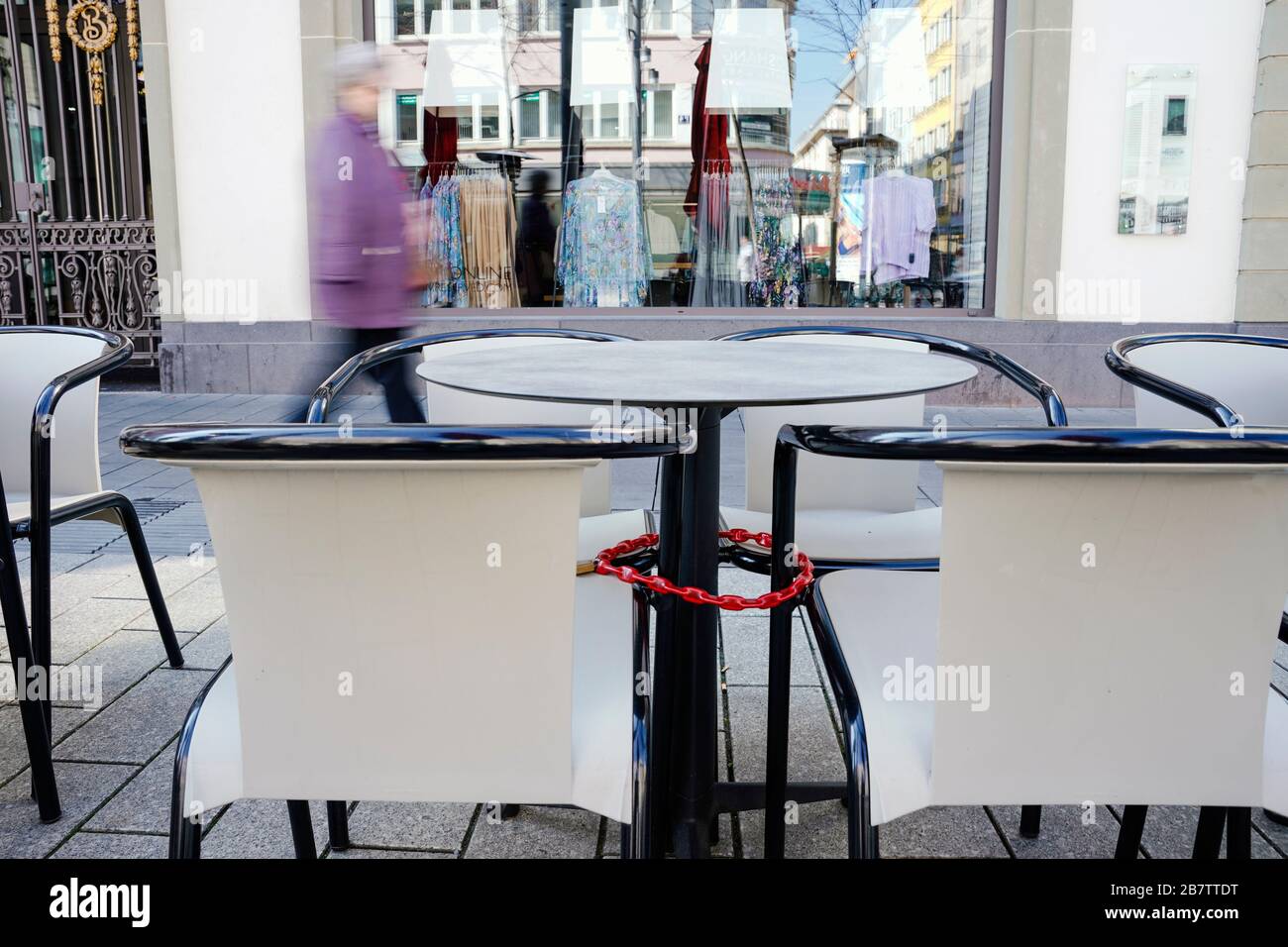 Mannheim, Germany. 18th Mar, 2020. In the morning, a pedestrian walks ...