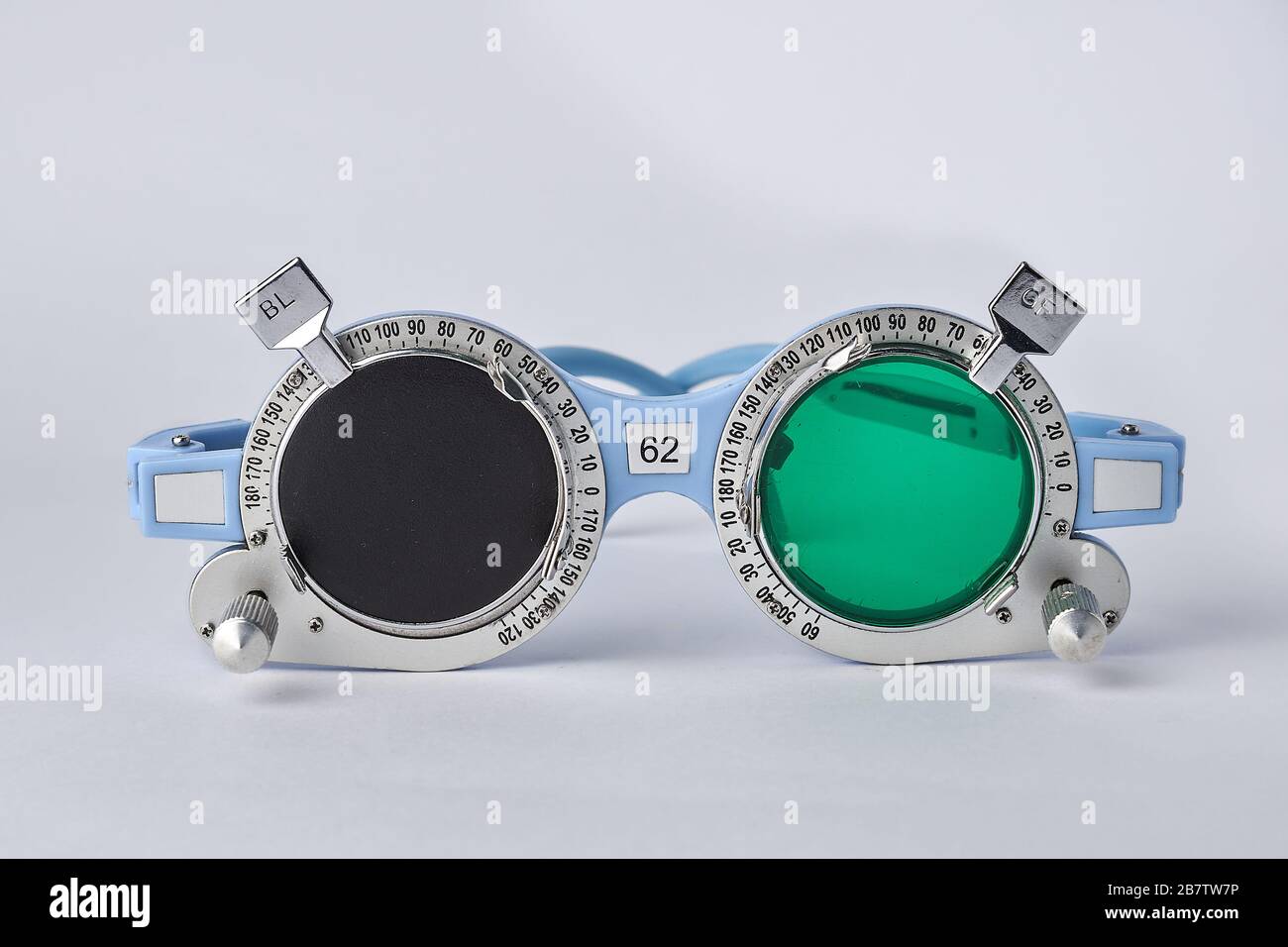 Optometrist medical equipment tools of green filter on trial frame test ...